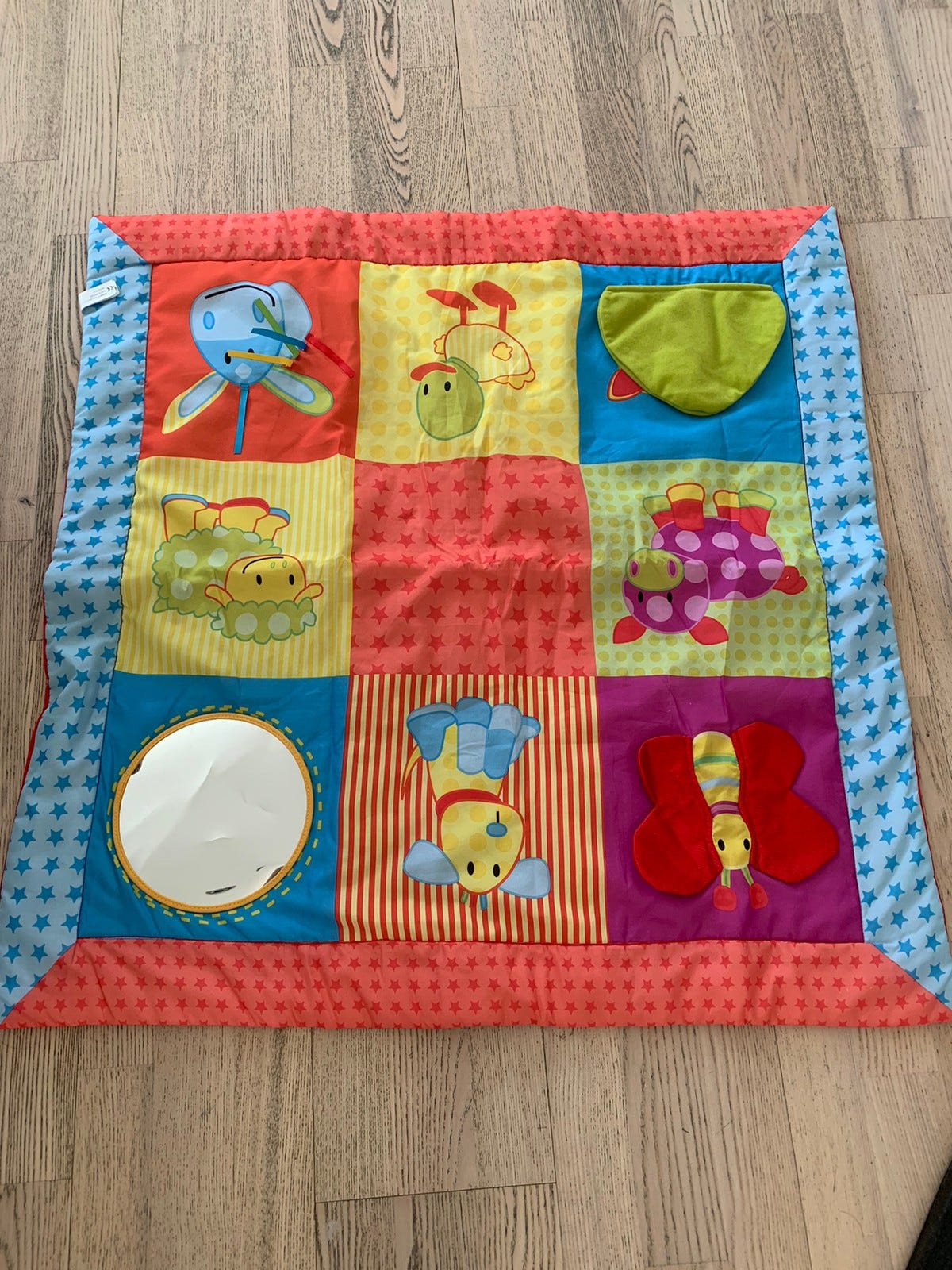 Like new. Handy baby mat with things to touch, mirror, scrunch sound ...