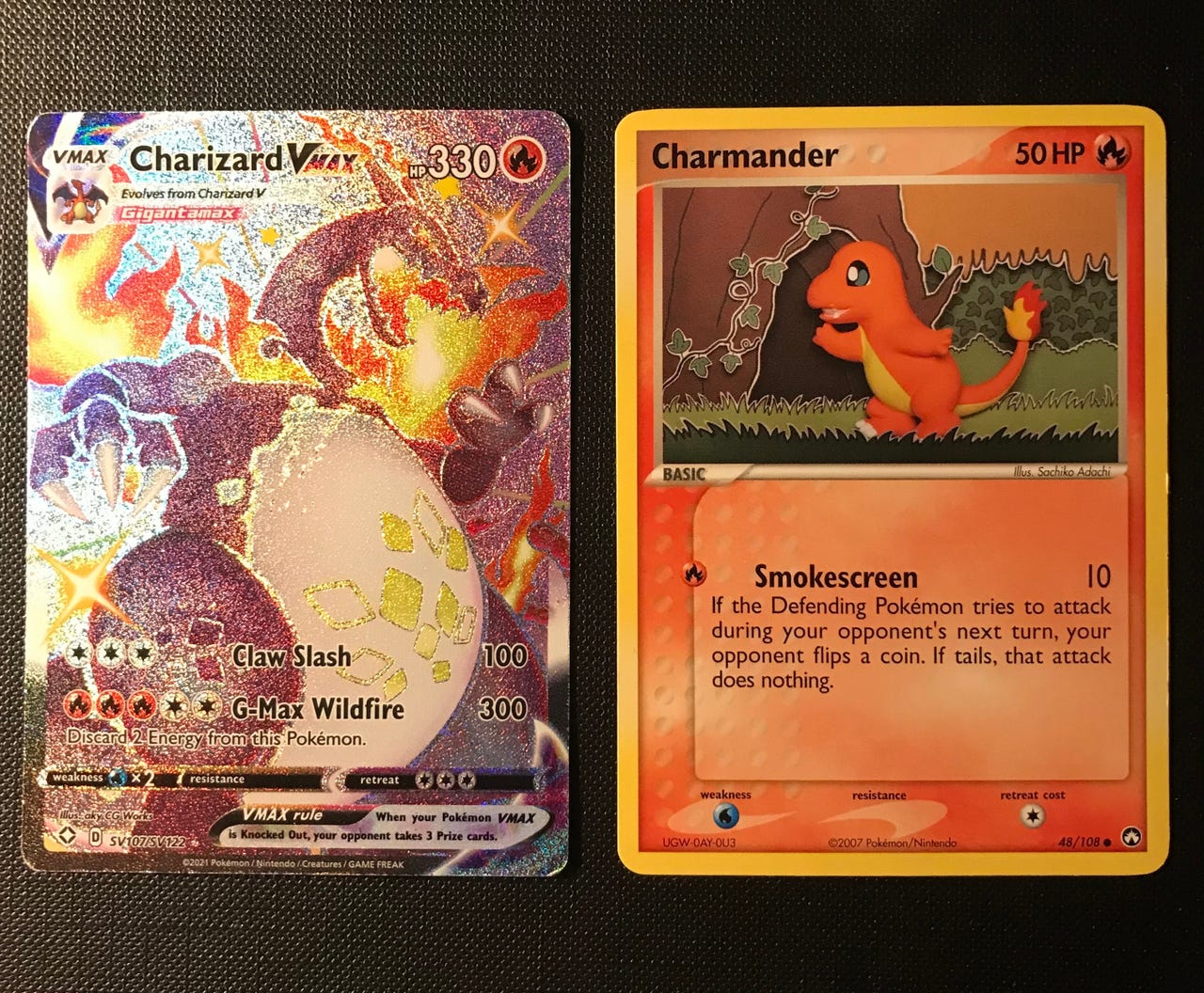 Charizard VMax SV107/SV122 & Charmander pokemon kort | FINN torget