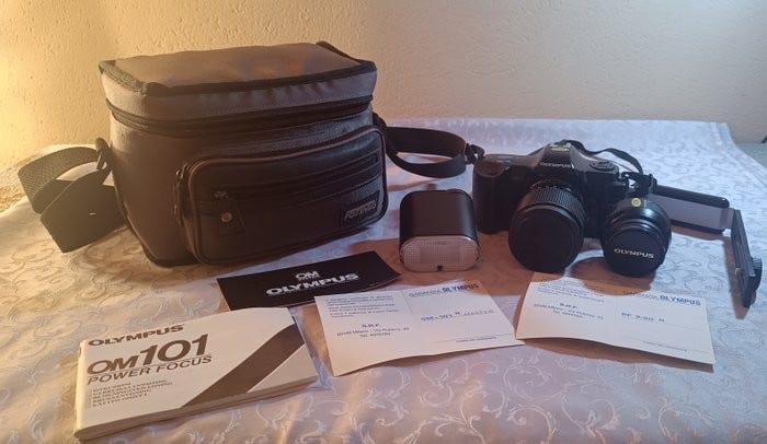 Olympus OM101 Power focus con 2 obbiettivi ,staffa, flash, borsa e accessori Ana | FINN-torget