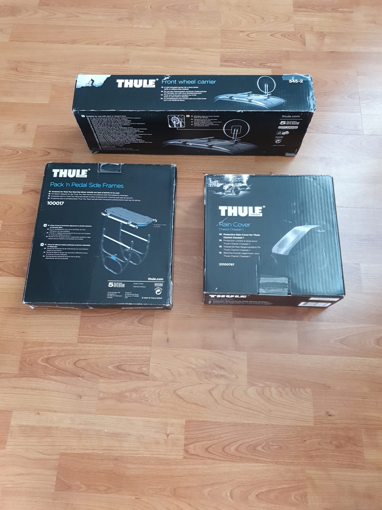 Thule utstyr: 1. Pack'n Pedal Side Frames 2. Rain cover 3. Front wheel ...